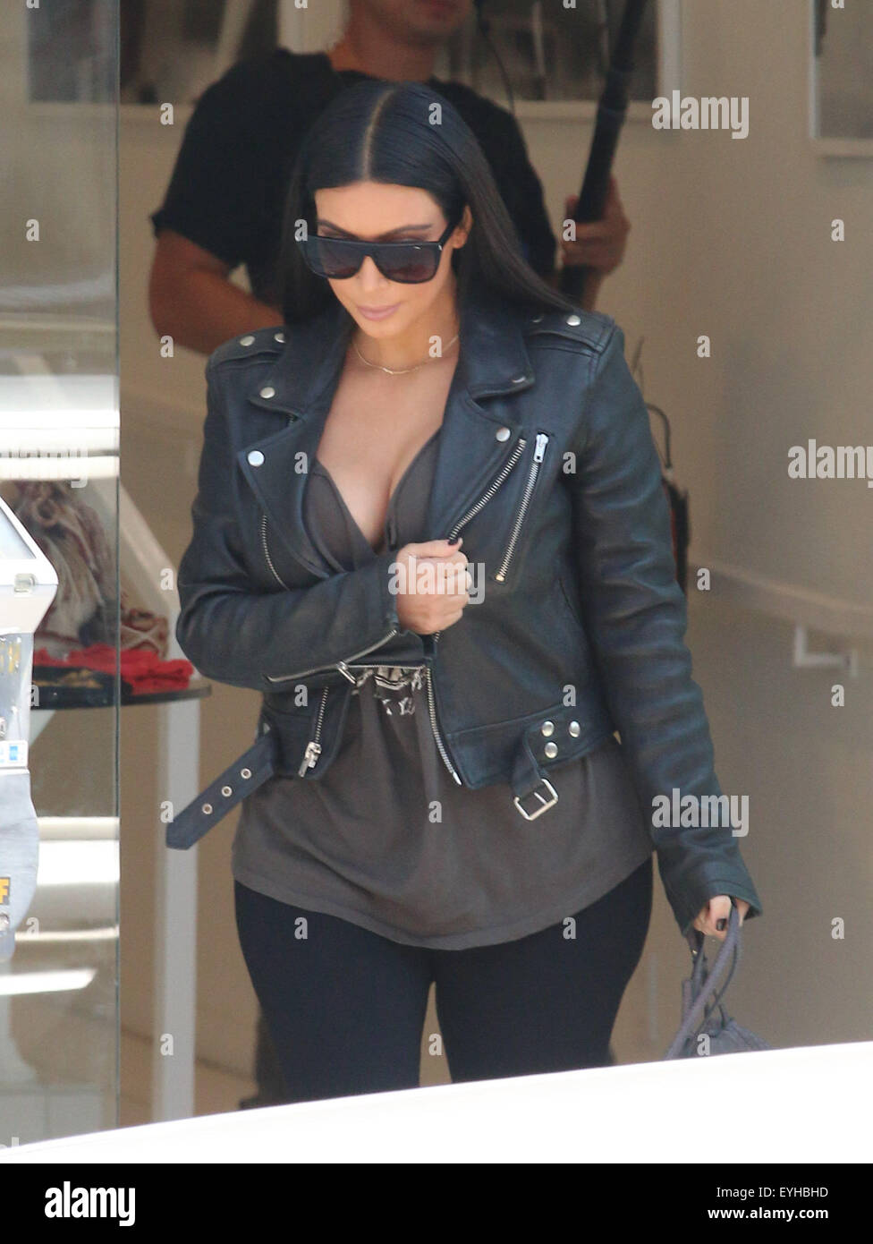 Kim Kardashian filming a scene at the DASH store for her reality show ...