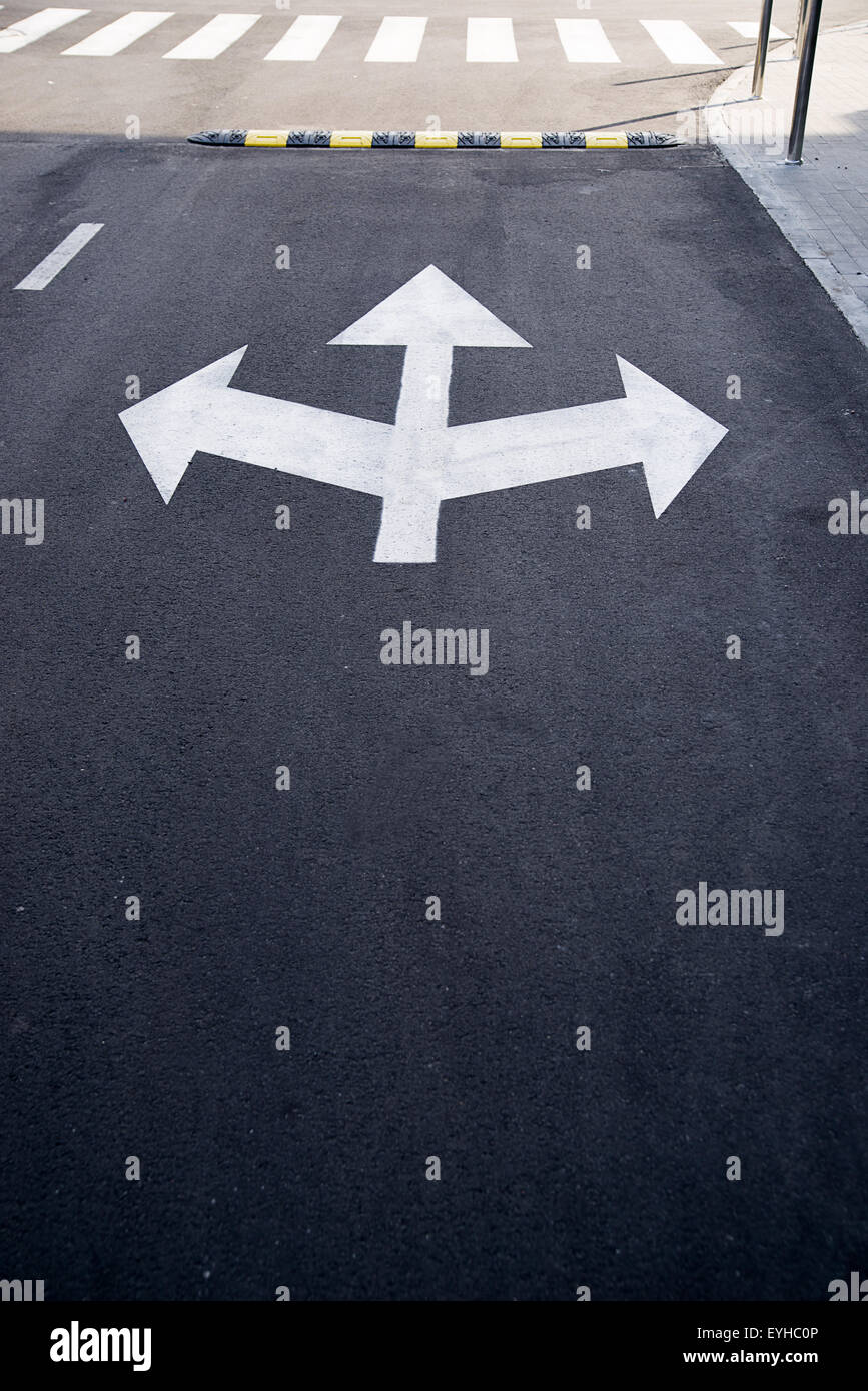 Road markings in the form of arrows on the asphalt road in the city ...