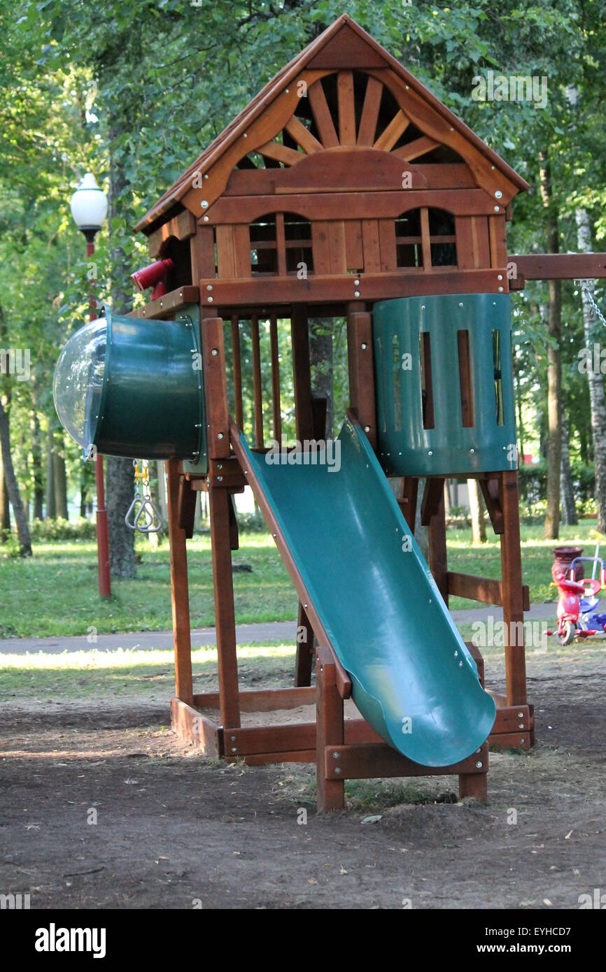 wooden clear retro style slide on child playground in summer park Stock ...