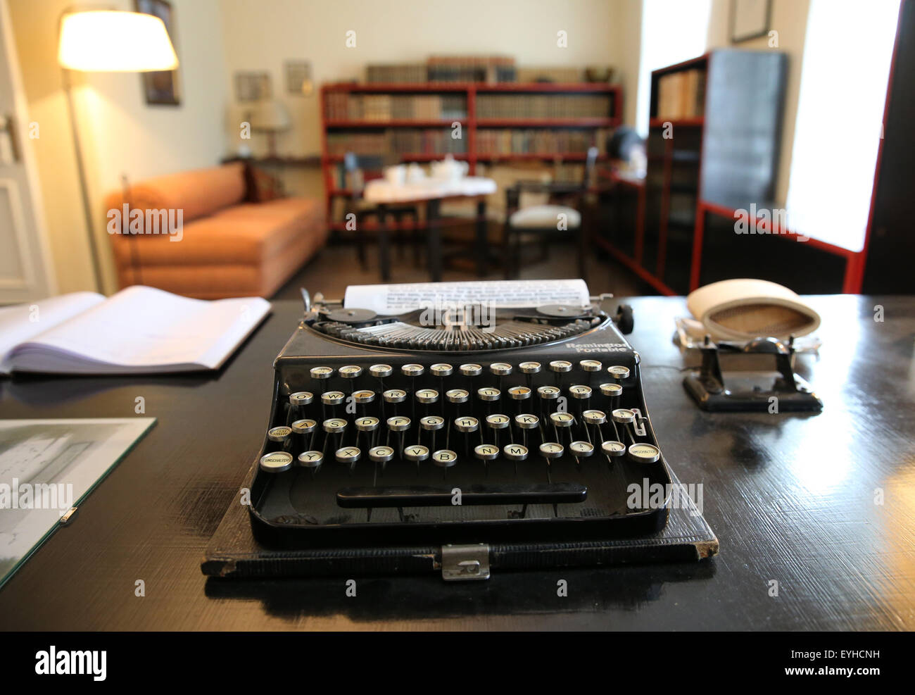 An old typewriter stands on a desk in the study and living room of ...