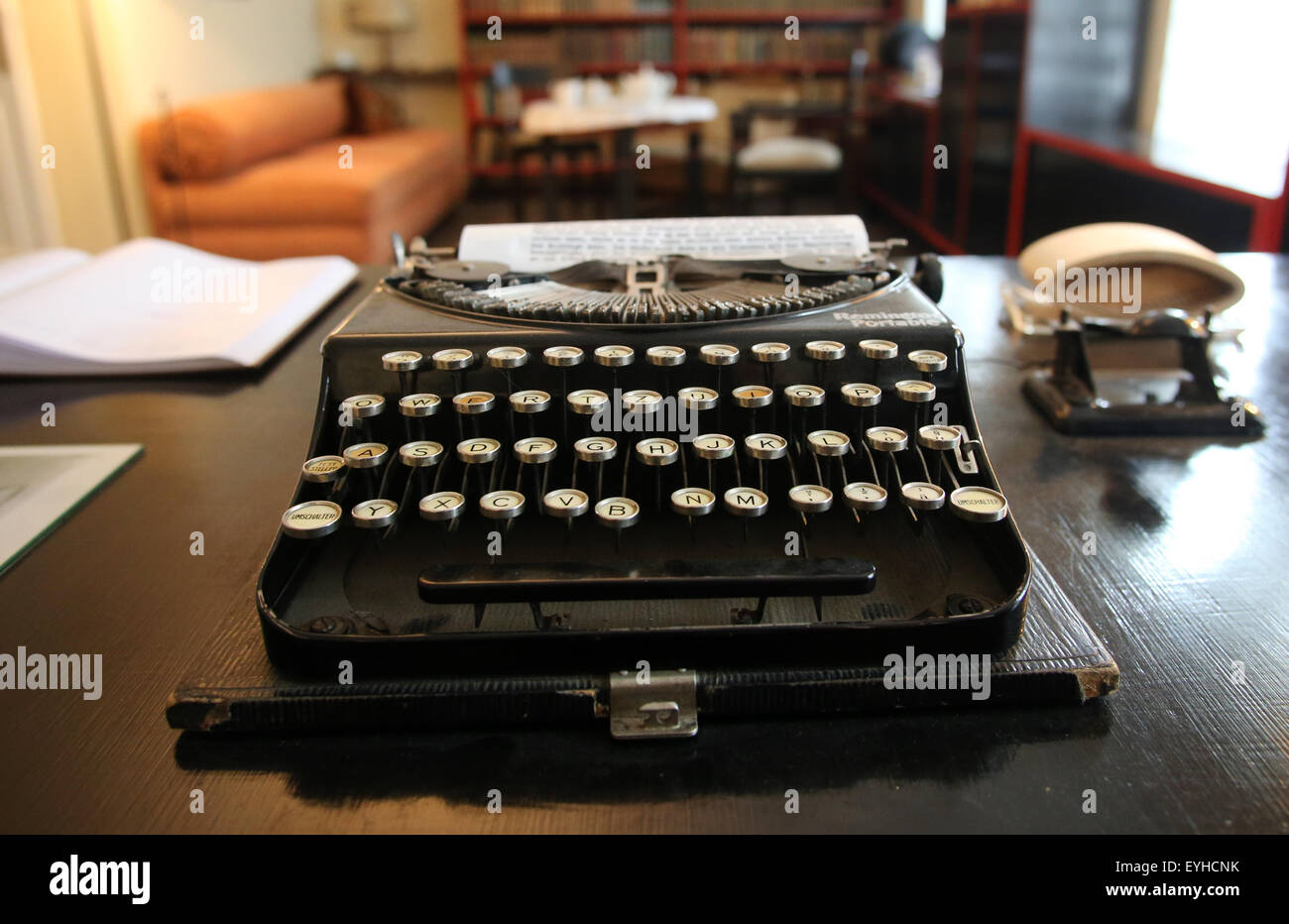 An old typewriter stands on a desk in the study and living room of ...