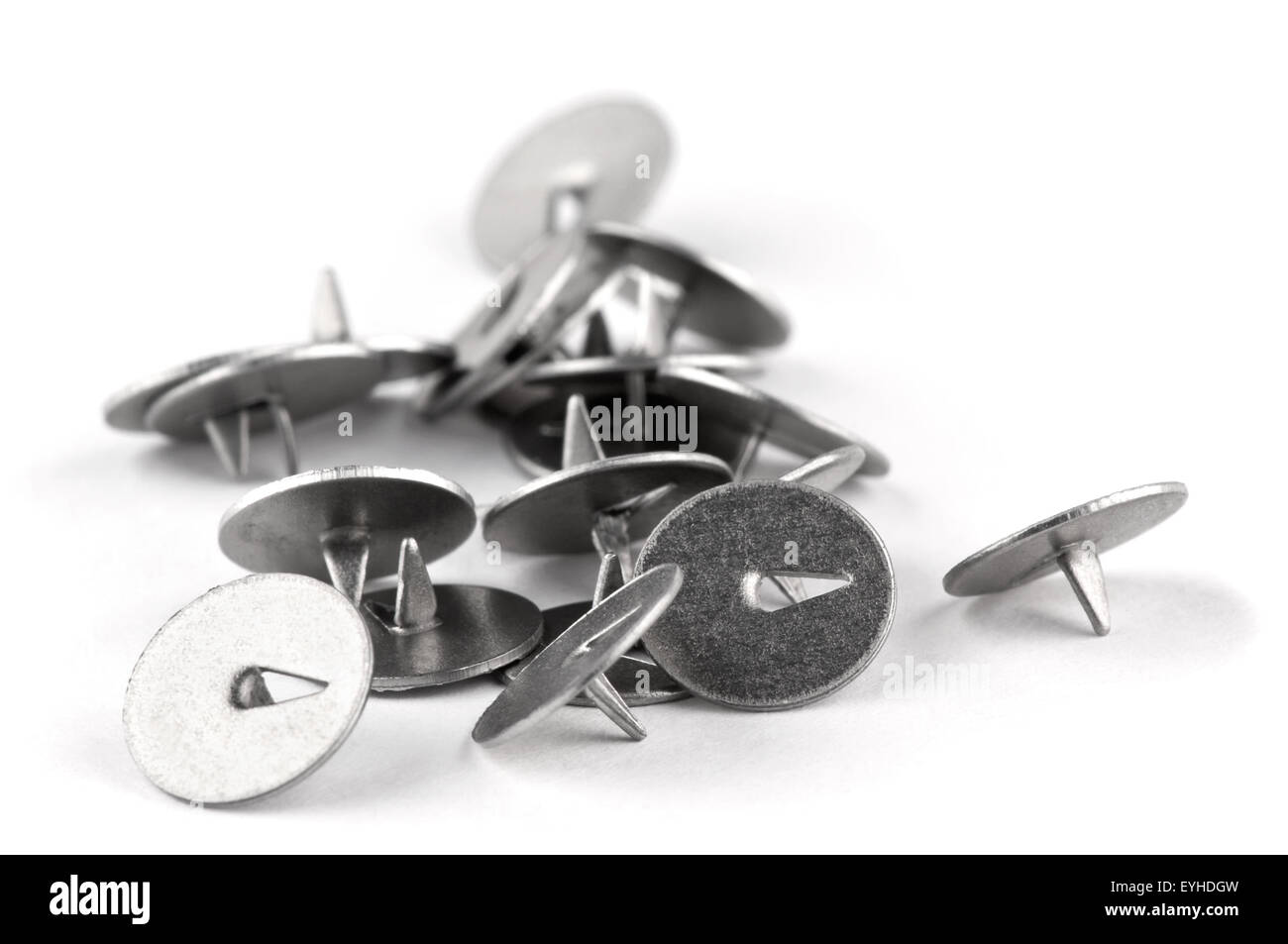 Pushpins on white background Stock Photo - Alamy