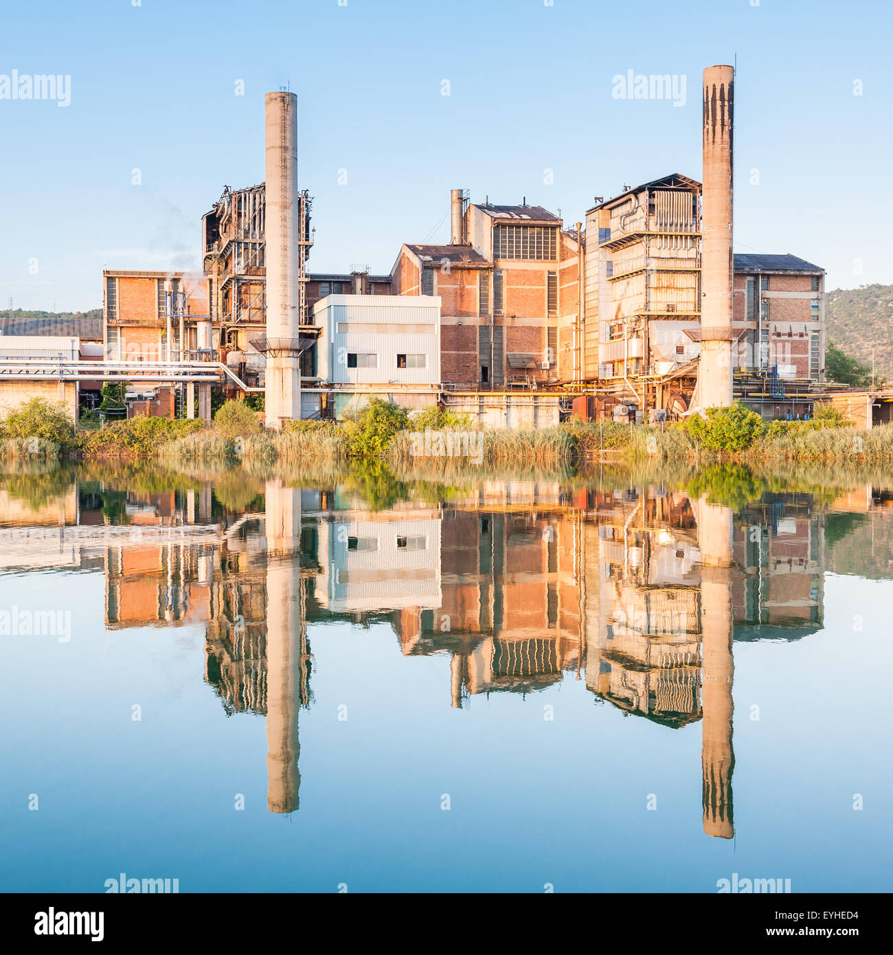 Old paper factory that is reflected in the river Stock Photo - Alamy