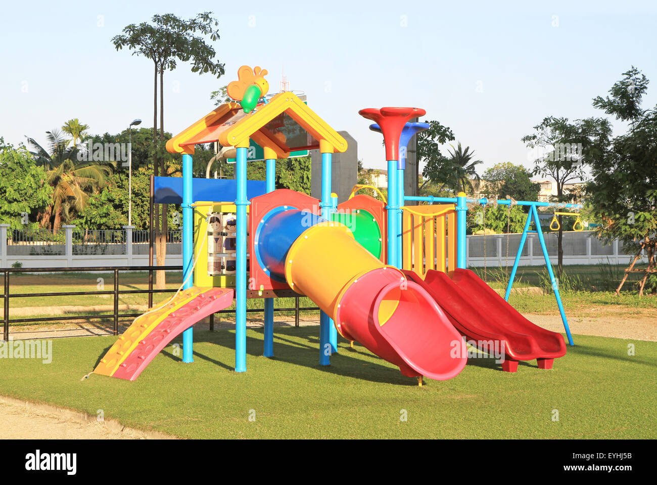 Colorful children playground in the park Stock Photo - Alamy