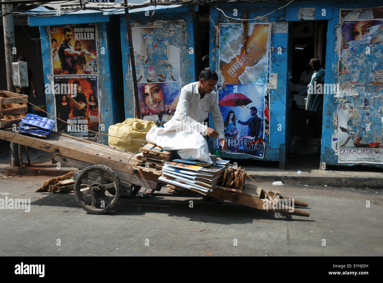Man loading a wooden cart with goods, Mumbai, India Stock Photo - Alamy