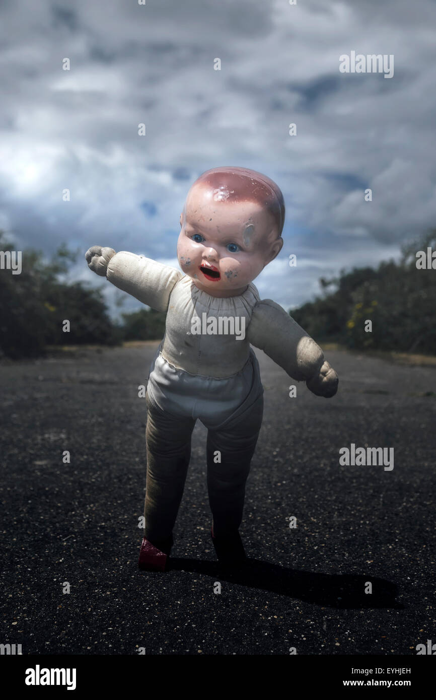 a damaged vintage doll, just about to fall Stock Photo - Alamy