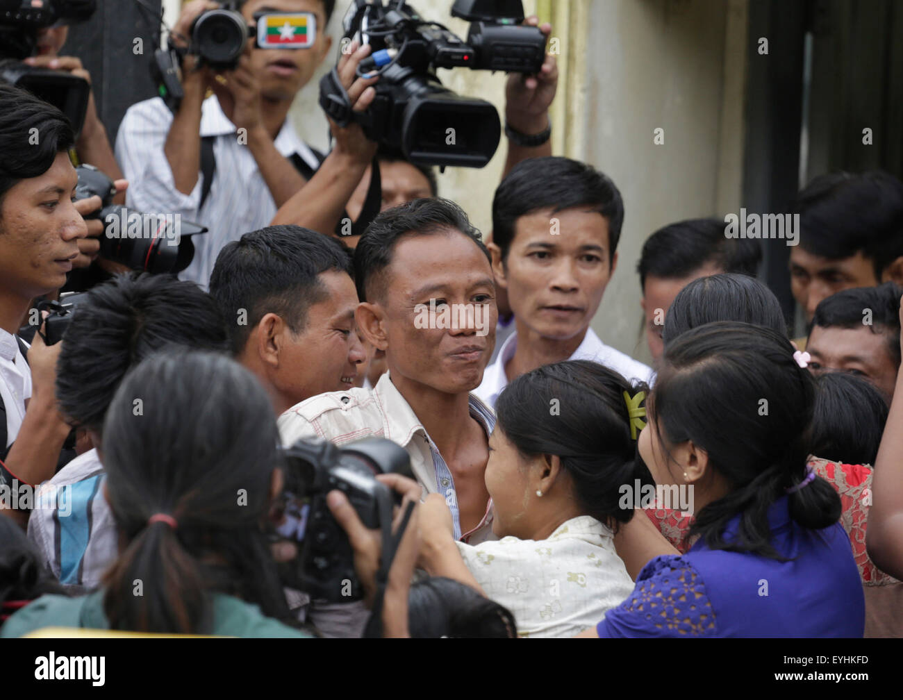 Yangon, Myanmar. 30th July, 2015. Released prisoners walk out of their ...