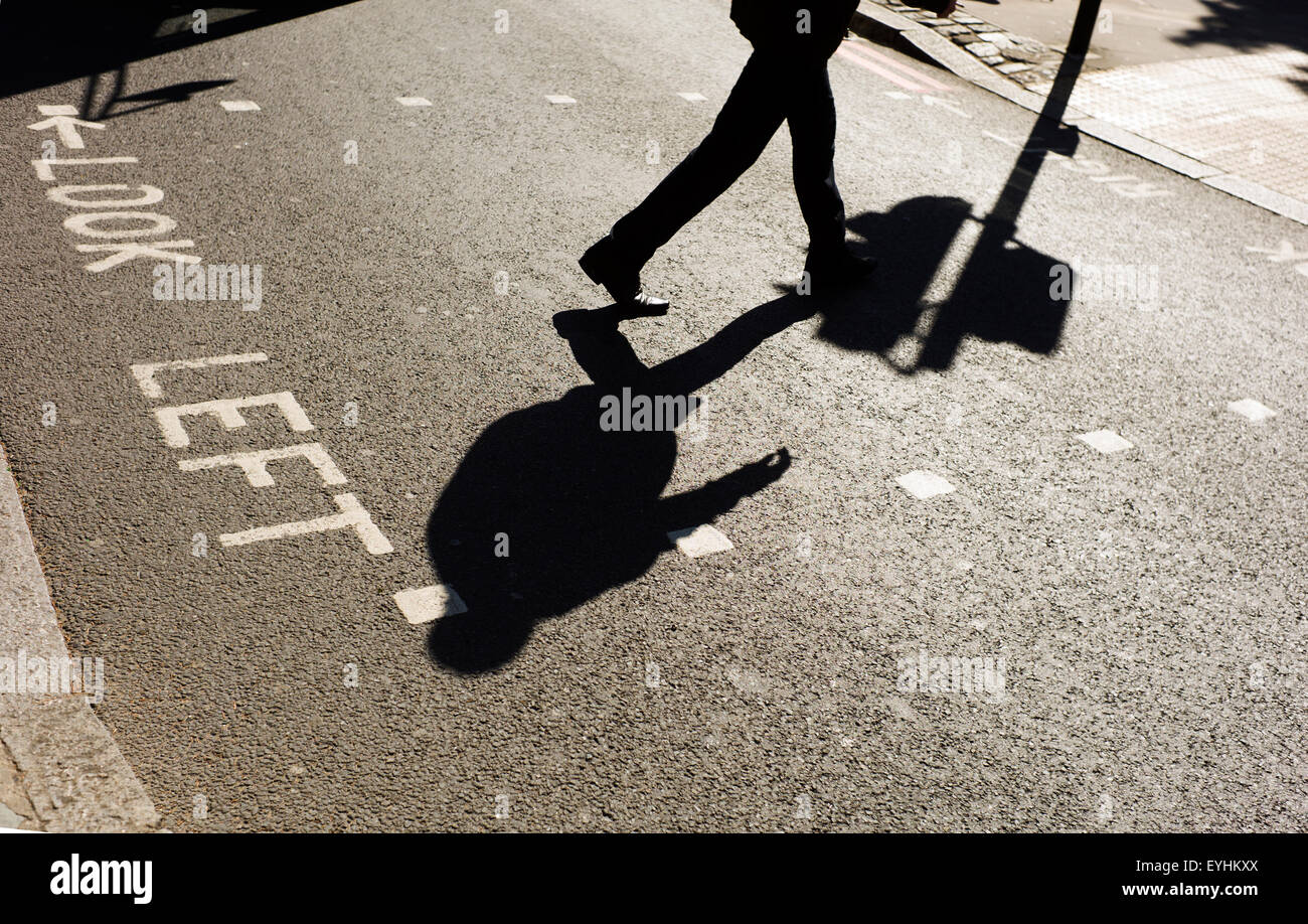 Shadows of workers going to work in the City of London. England UK ...