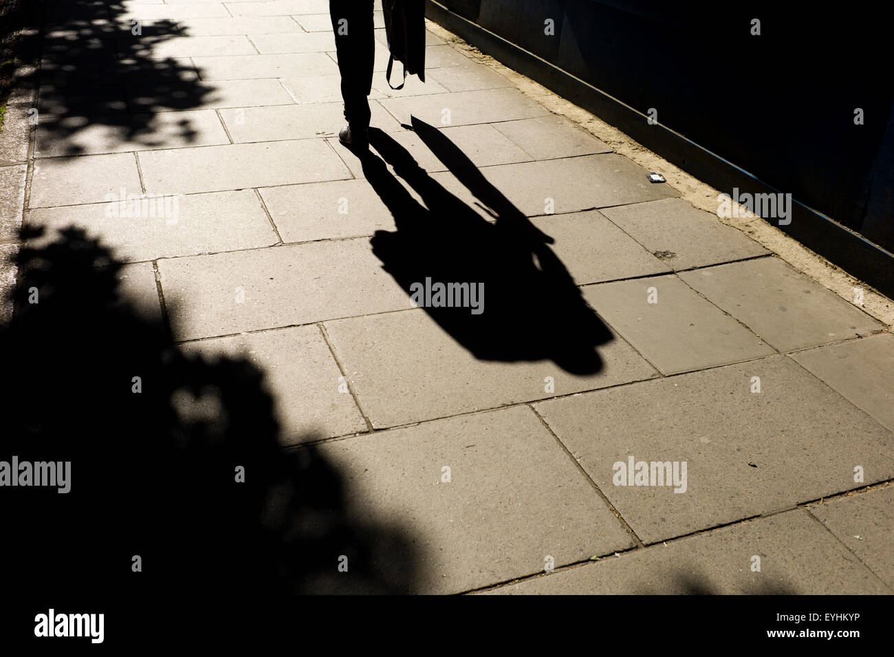 Shadows of workers going to work in the City of London. England UK ...