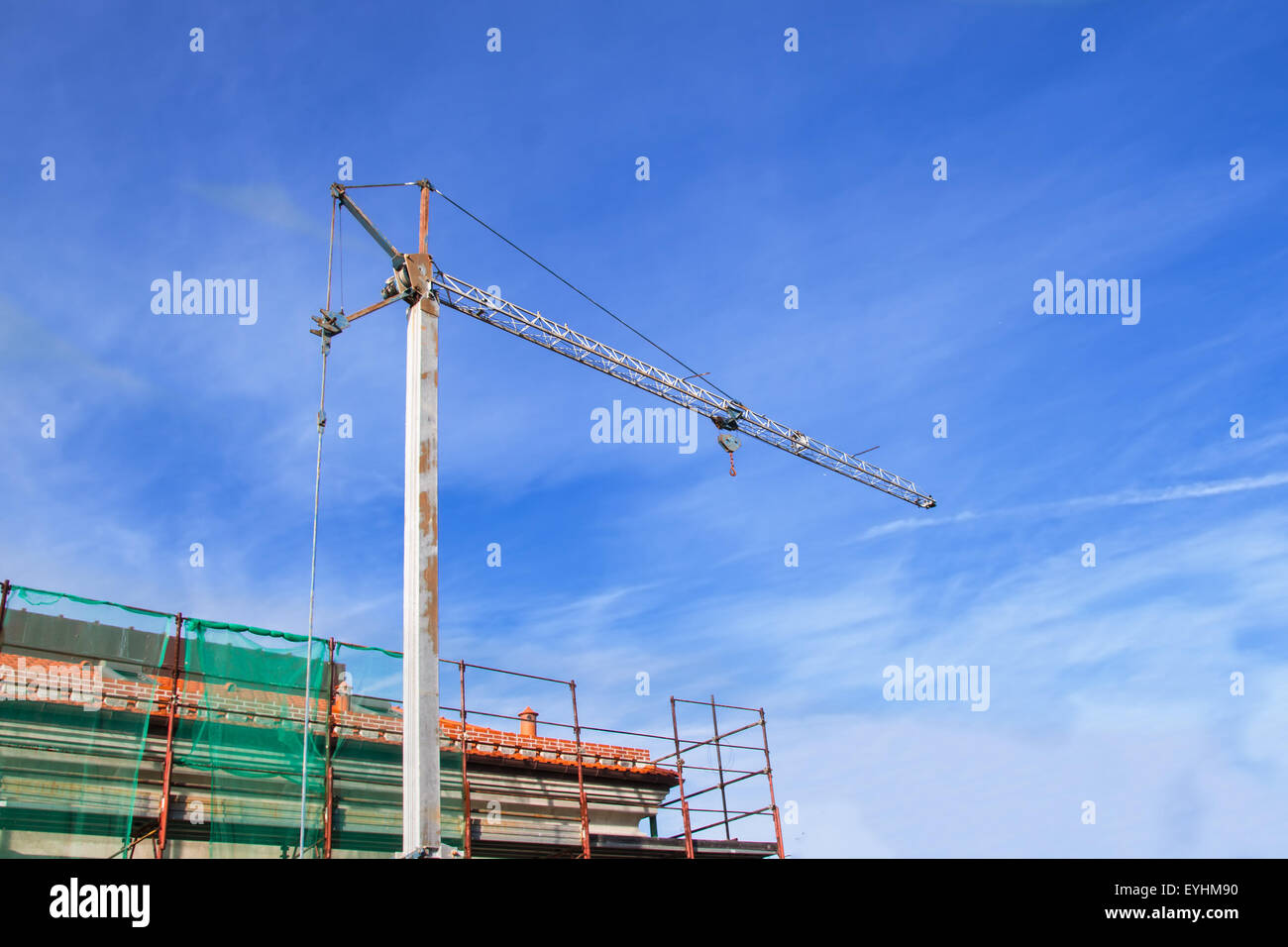 small construction crane used in building renovation Stock Photo - Alamy