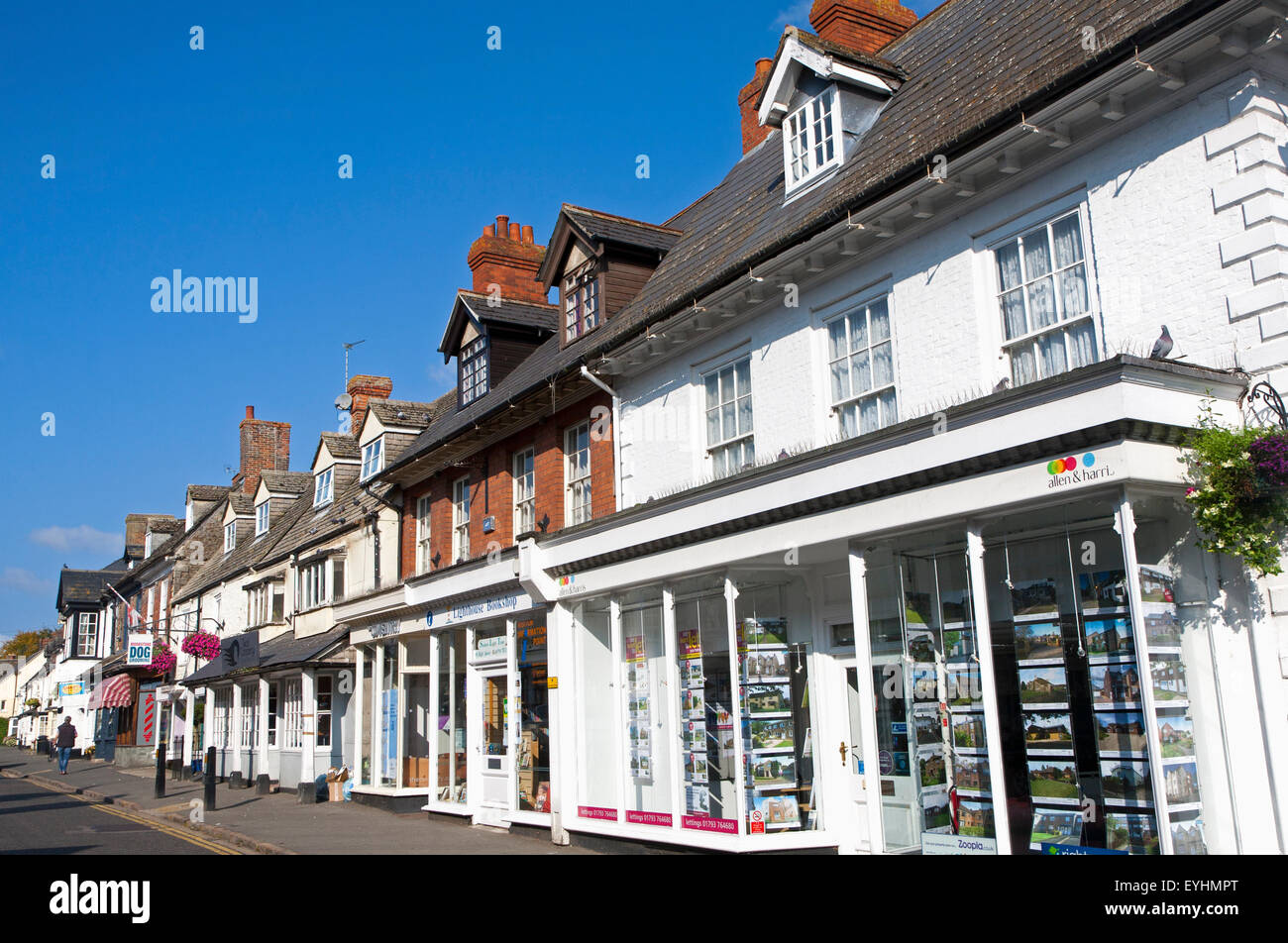 Row of shops in historic buildings in Highworth, Wiltshire, England, UK ...