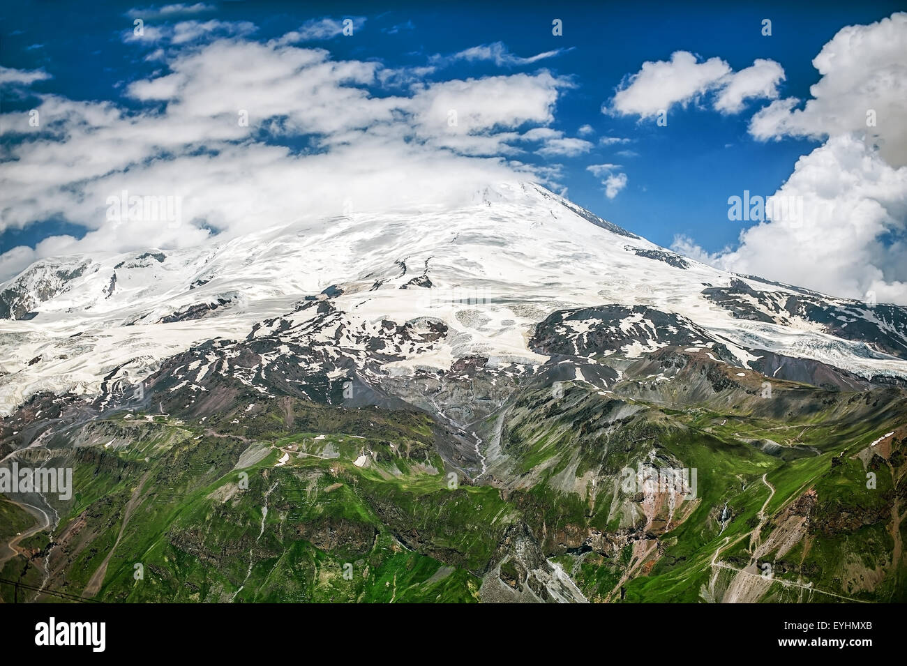 Mount Elbrus in clouds. View from top of Cheget mountain Stock Photo ...