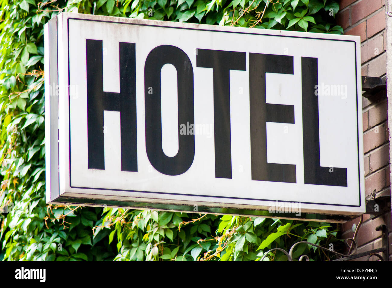 Simple slightly dirty Hotel sign Stock Photo - Alamy
