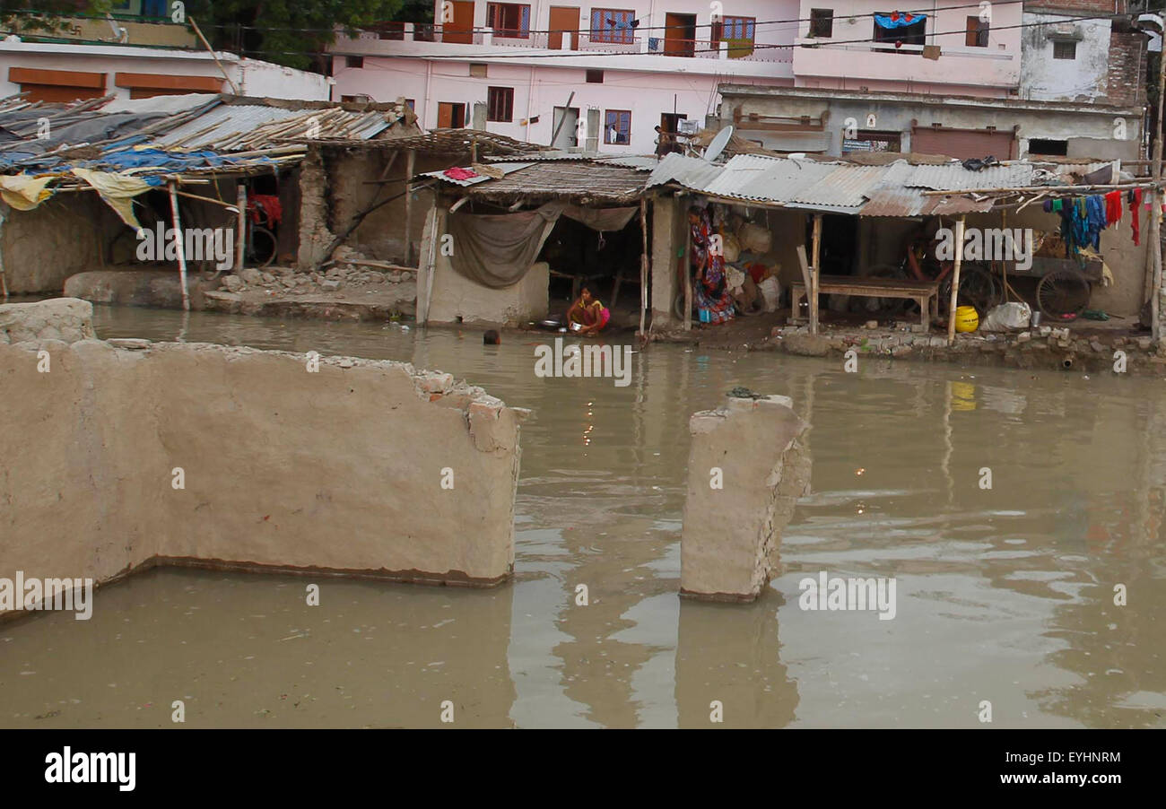 Allahabad, India. 30th July, 2015. A girl watching the flood water ...
