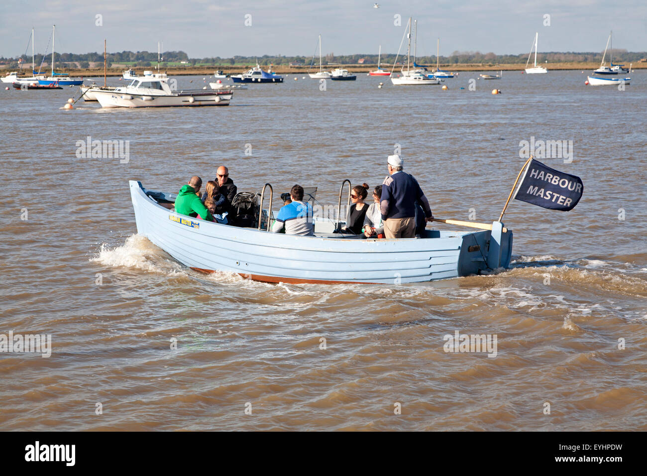 Small ferry boat crossing River Deben between Bawdsey Quay and ...