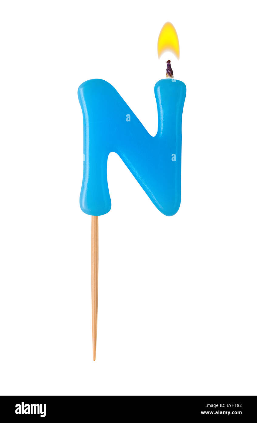 Burning candles in the form of the letter N Stock Photo - Alamy
