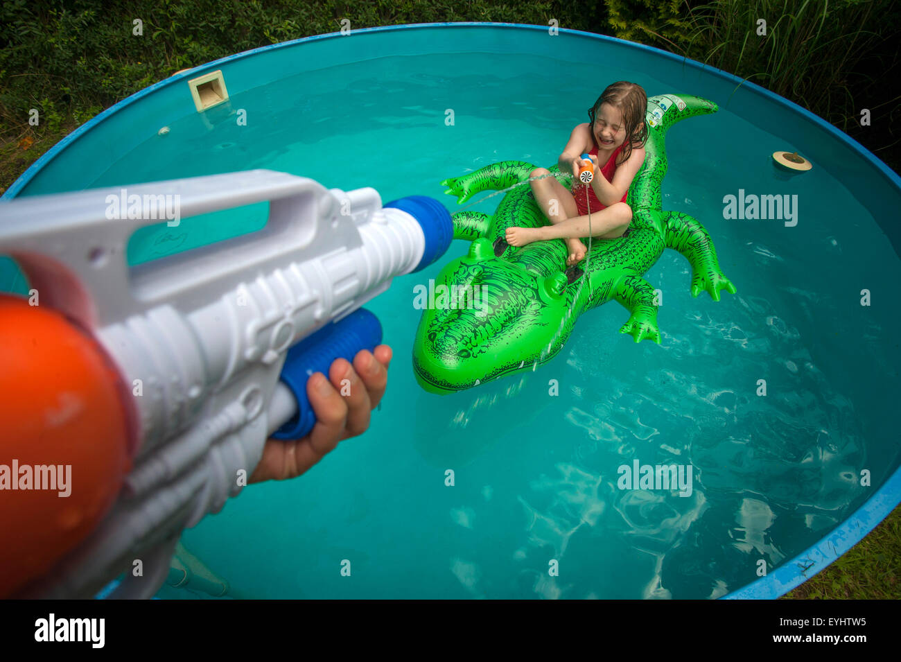 Pool water water fight hi-res stock photography and images - Alamy