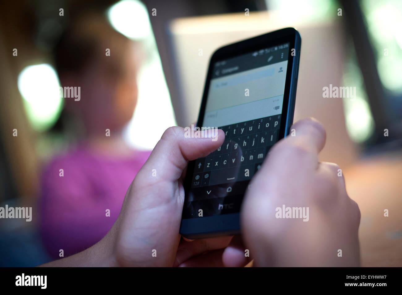 Teenager texting on a smart phone at home Stock Photo - Alamy