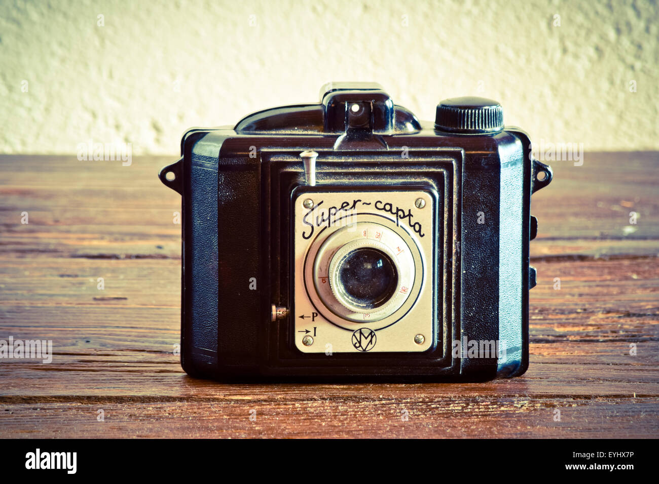 Old camera on wooden surface Stock Photo - Alamy