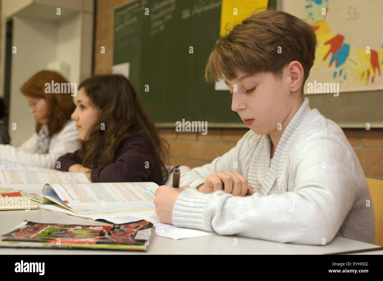 Student at German school writing left-handed, Hann, North Rhine ...