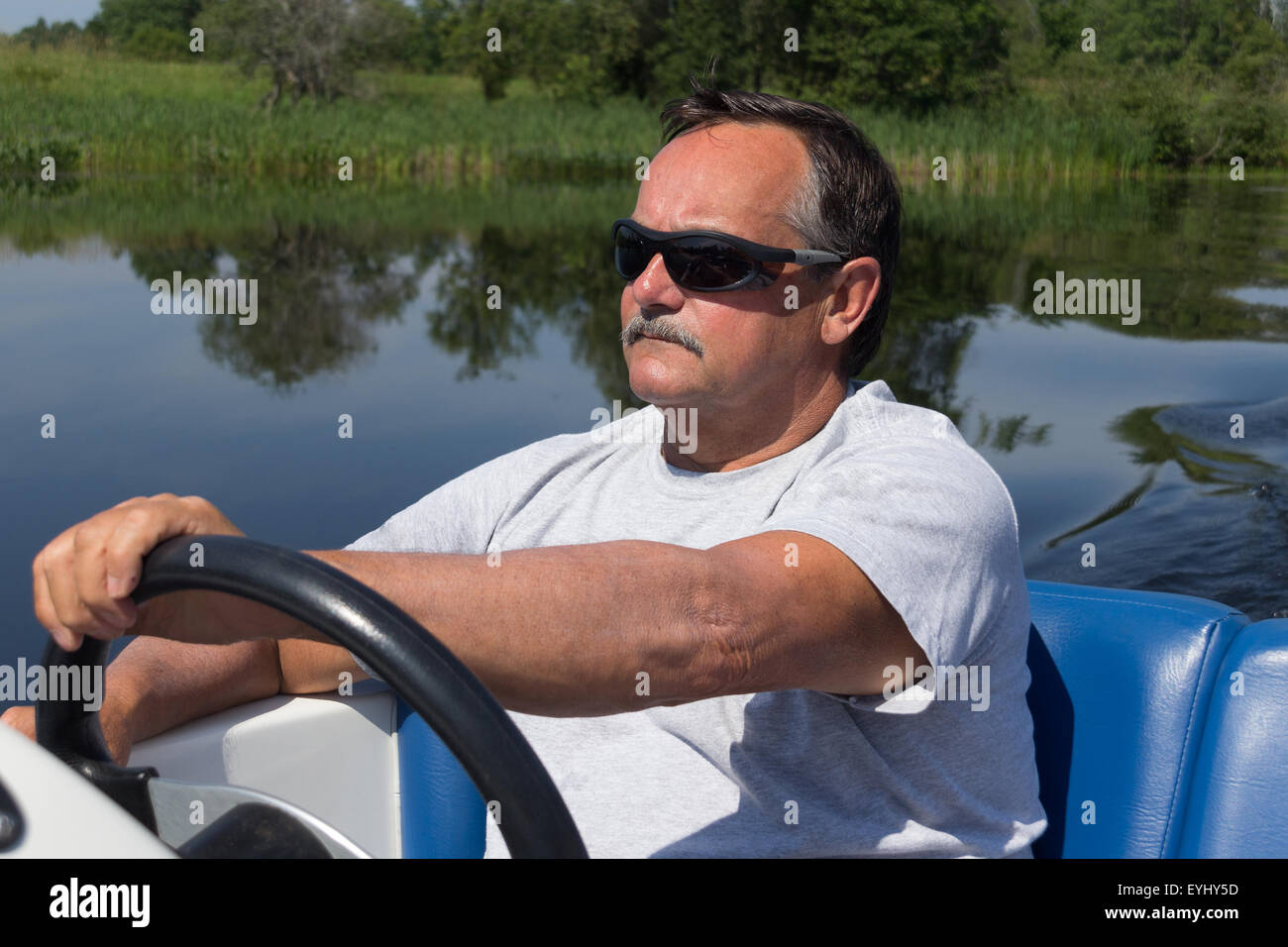 Person driving boat hi-res stock photography and images - Alamy