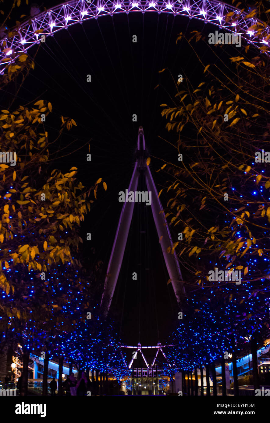 London, England. The London Eye at night. Purple and blue lights Stock ...