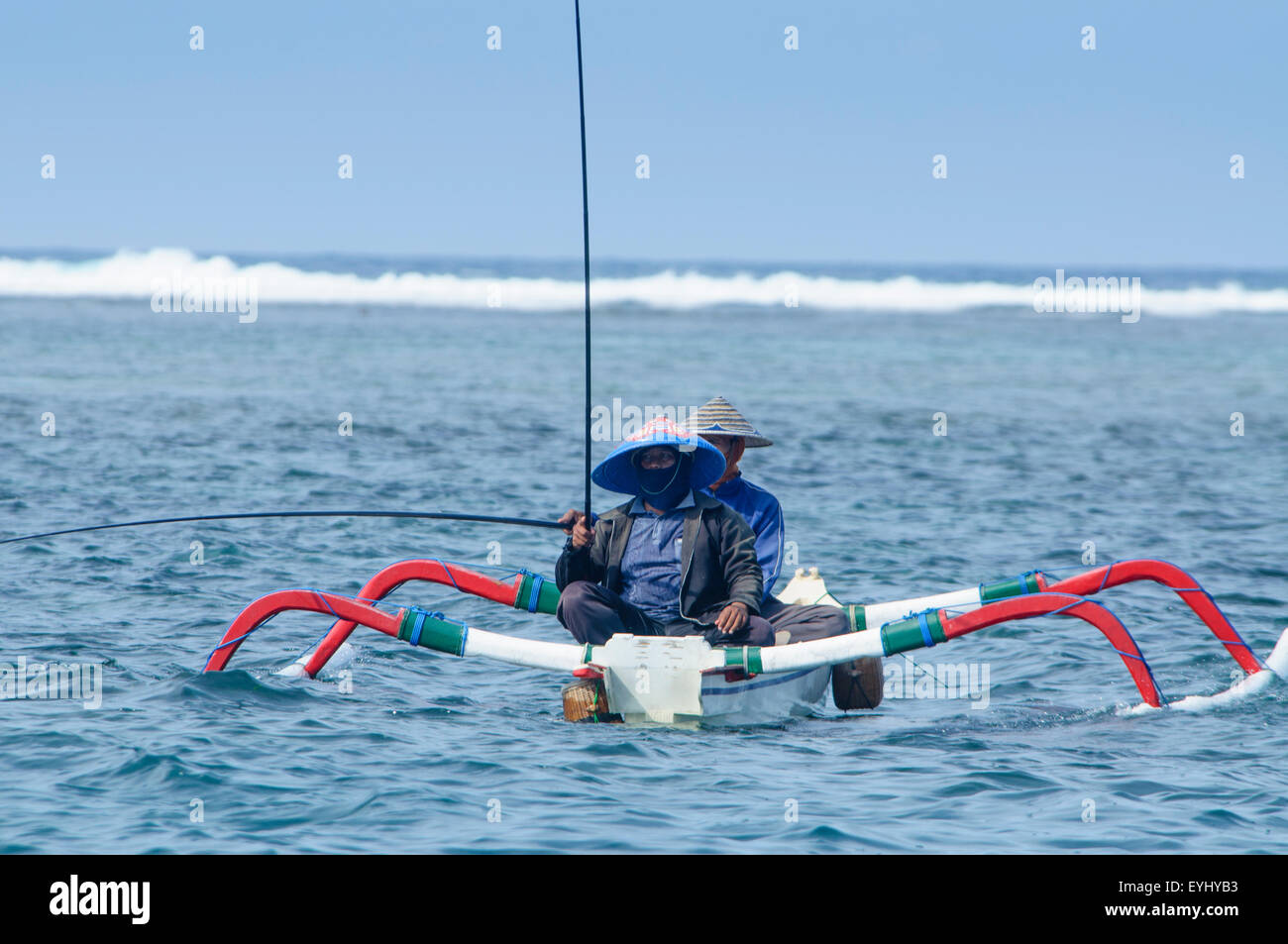 Two fishermen in a local outrigger boat, Sanur, Bali, Indonesia Stock ...