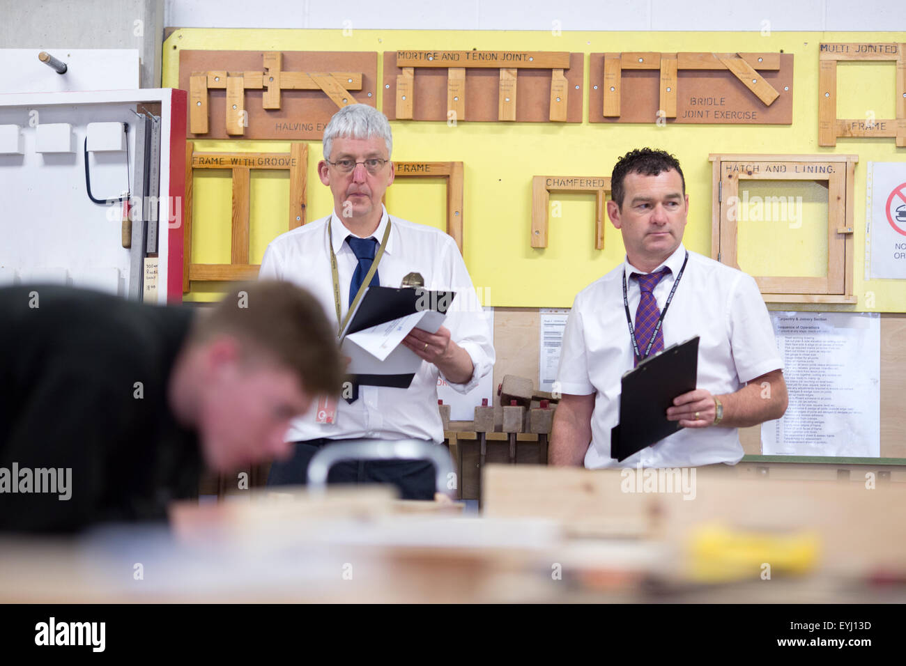teachers assess a wood work class at Bolton College Stock Photo - Alamy