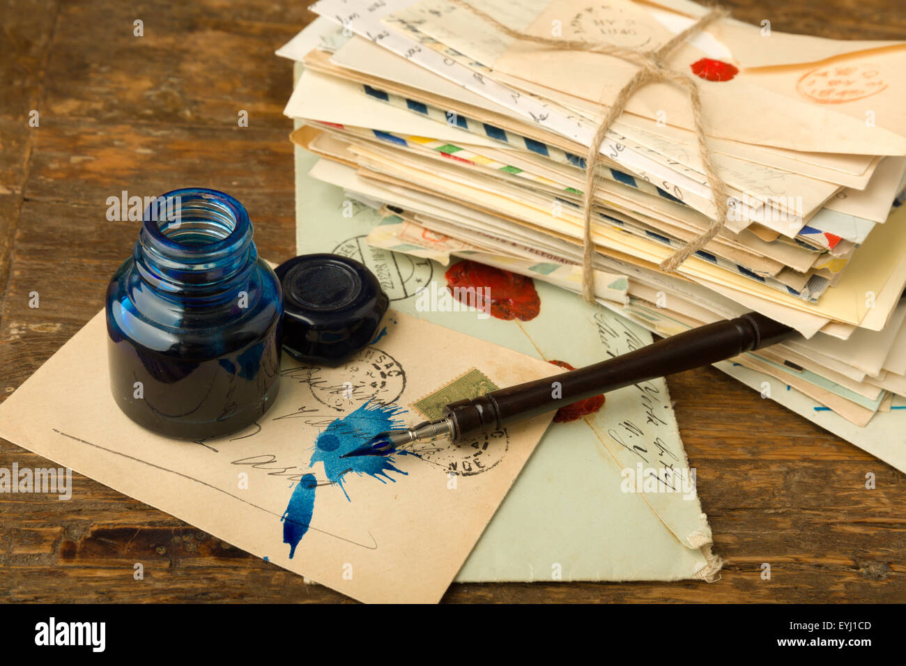 Vintage ink well and fountain pen on a table with old letters Stock ...