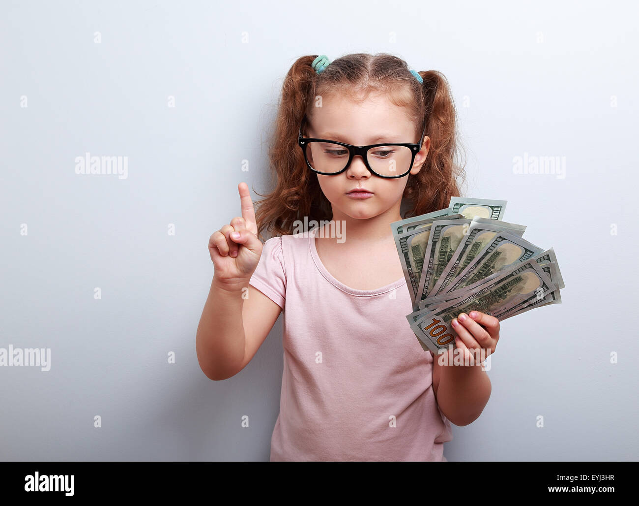 Child holding one dollar bill hi-res stock photography and images - Alamy