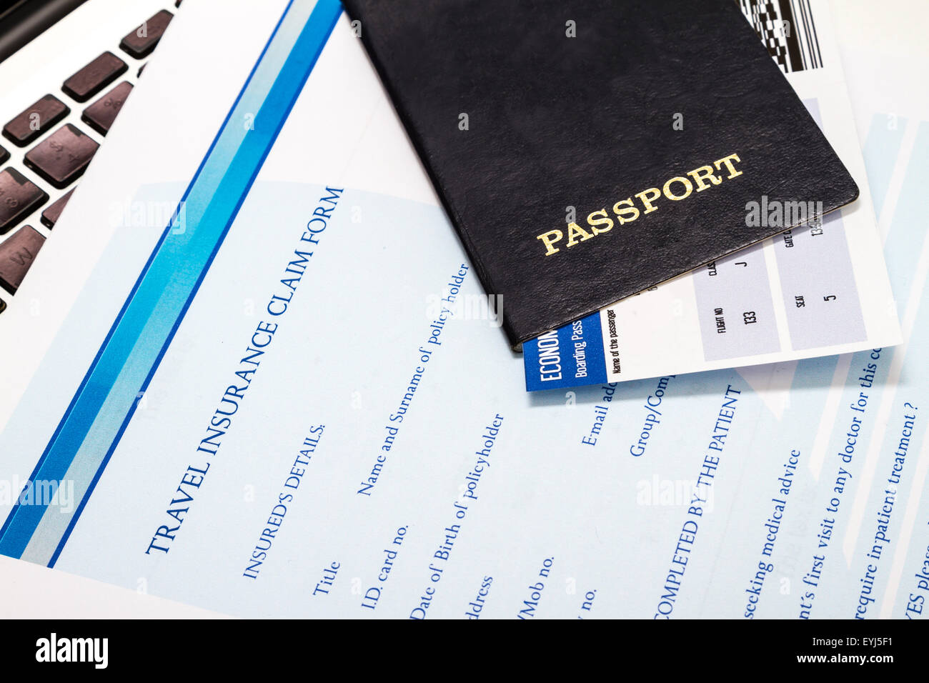 Travel insurance application form with a boarding pass and a passport ...