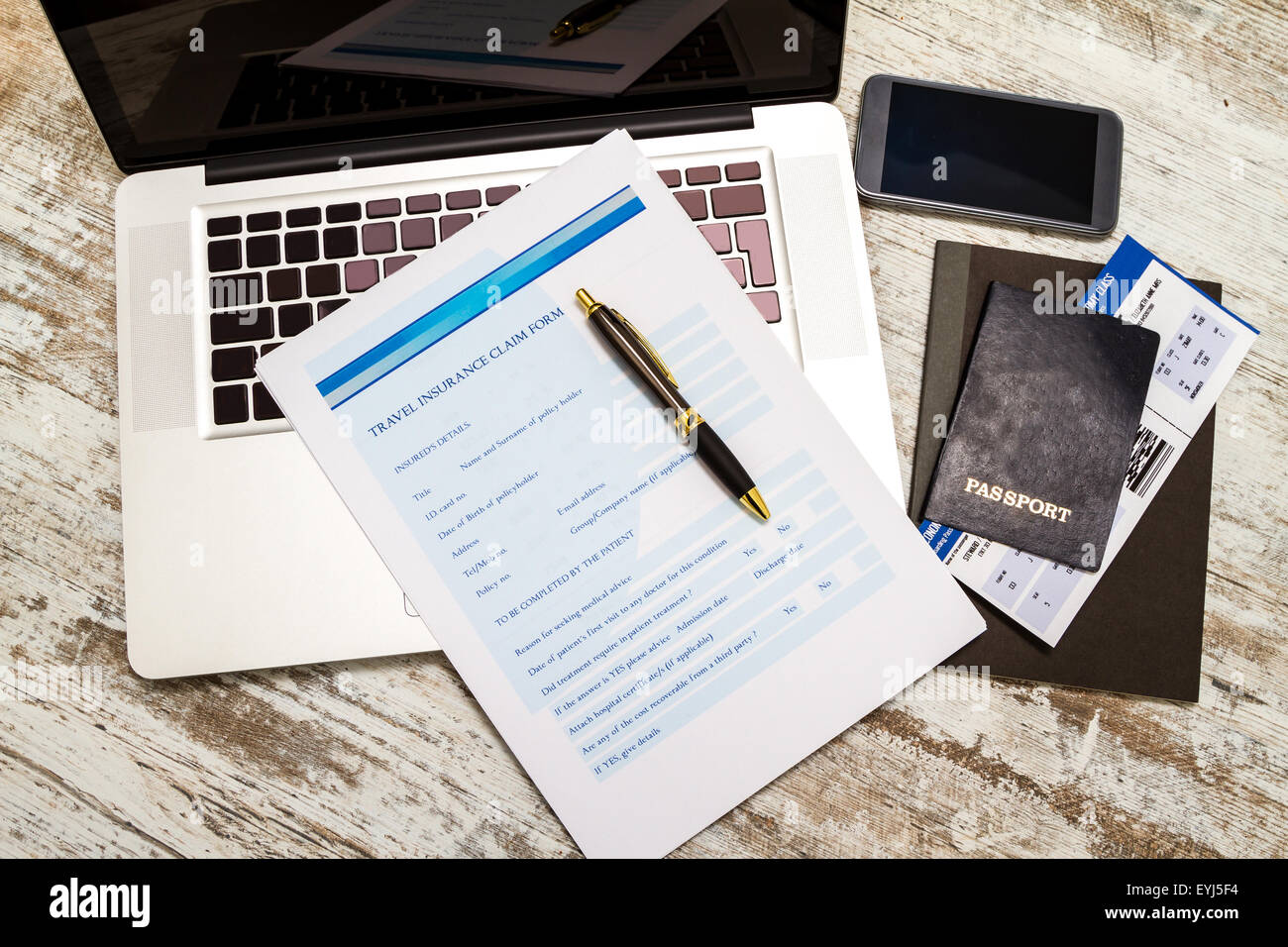 Travel insurance application form with a boarding pass and a passport ...
