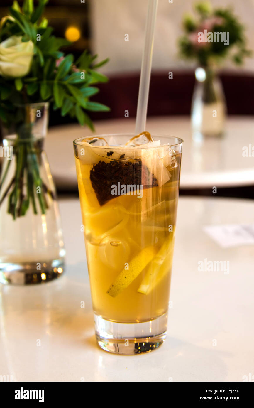 Drinking a glass of ice tea Stock Photo - Alamy