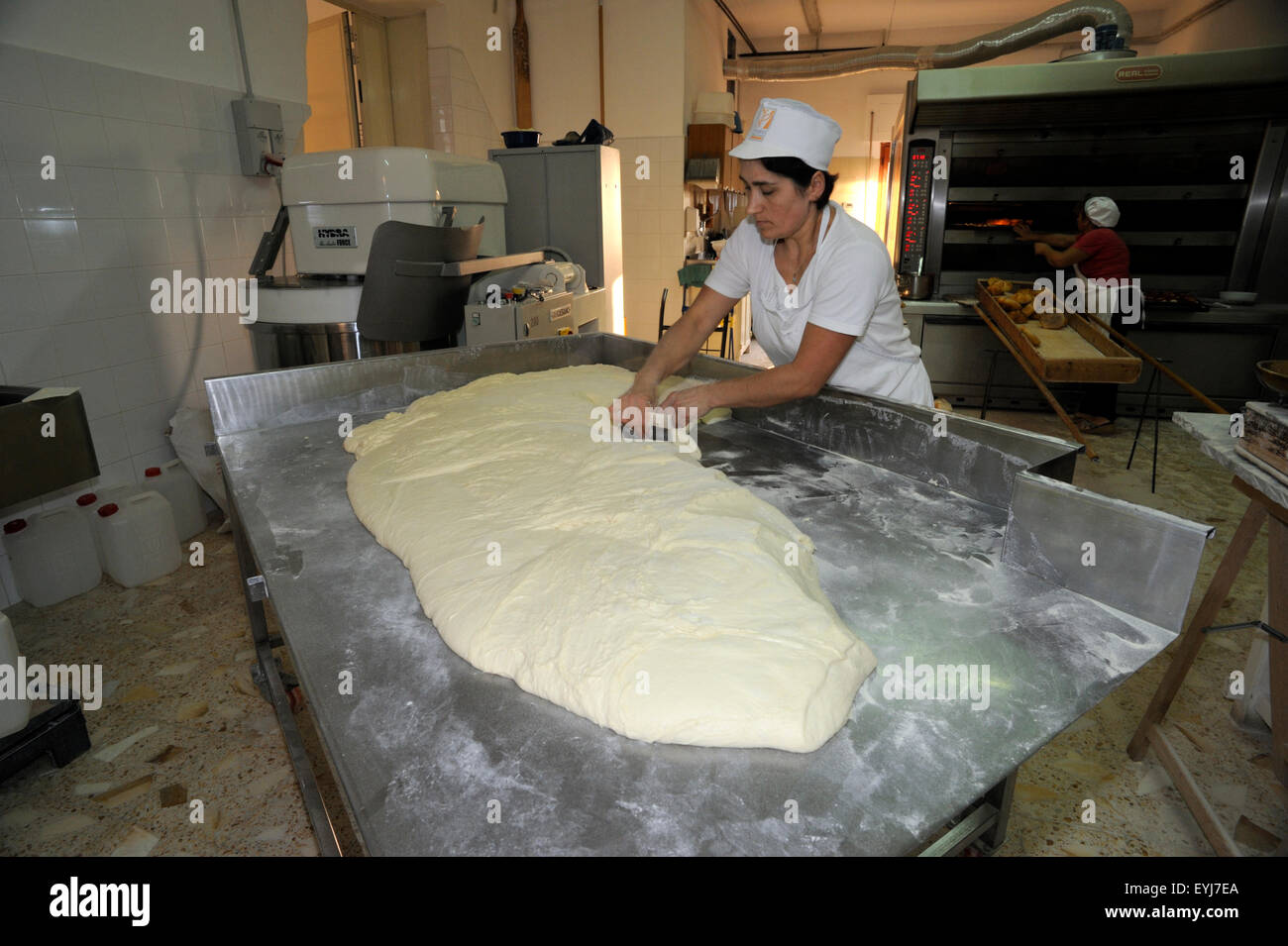 Italy, Basilicata, Roccanova, bakery, baker kneading bread Stock Photo ...