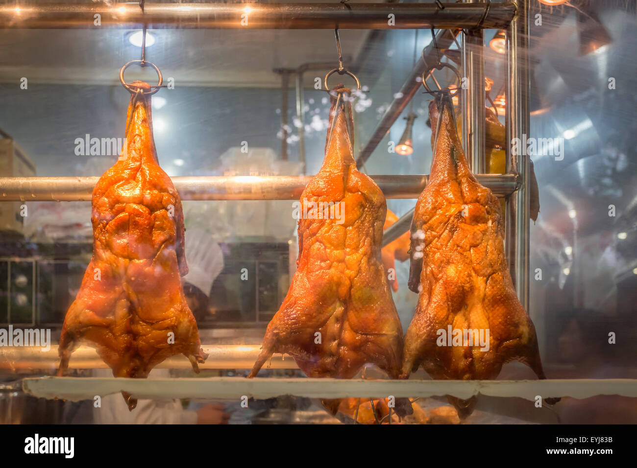 Three Roasted Ducks in a shop window Stock Photo - Alamy