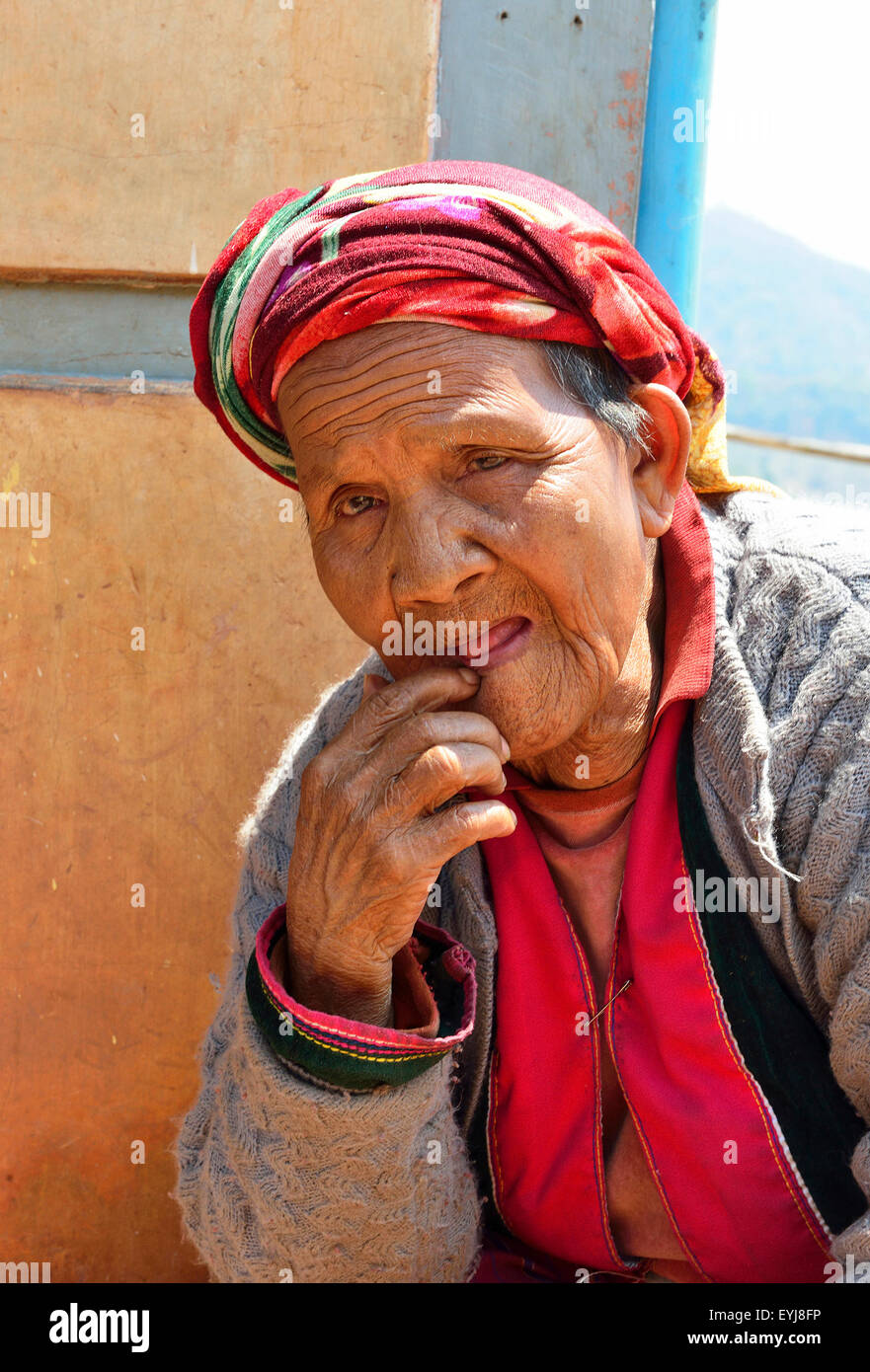 A Ta'ang tribal old lady in traditional clothes in a hilltop village nr ...