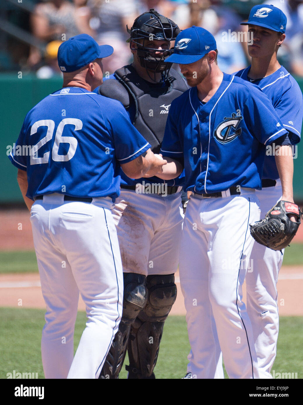 July 30, 2015:Columbus Clippers pitcher Josh Tomlin (right) hands the ...