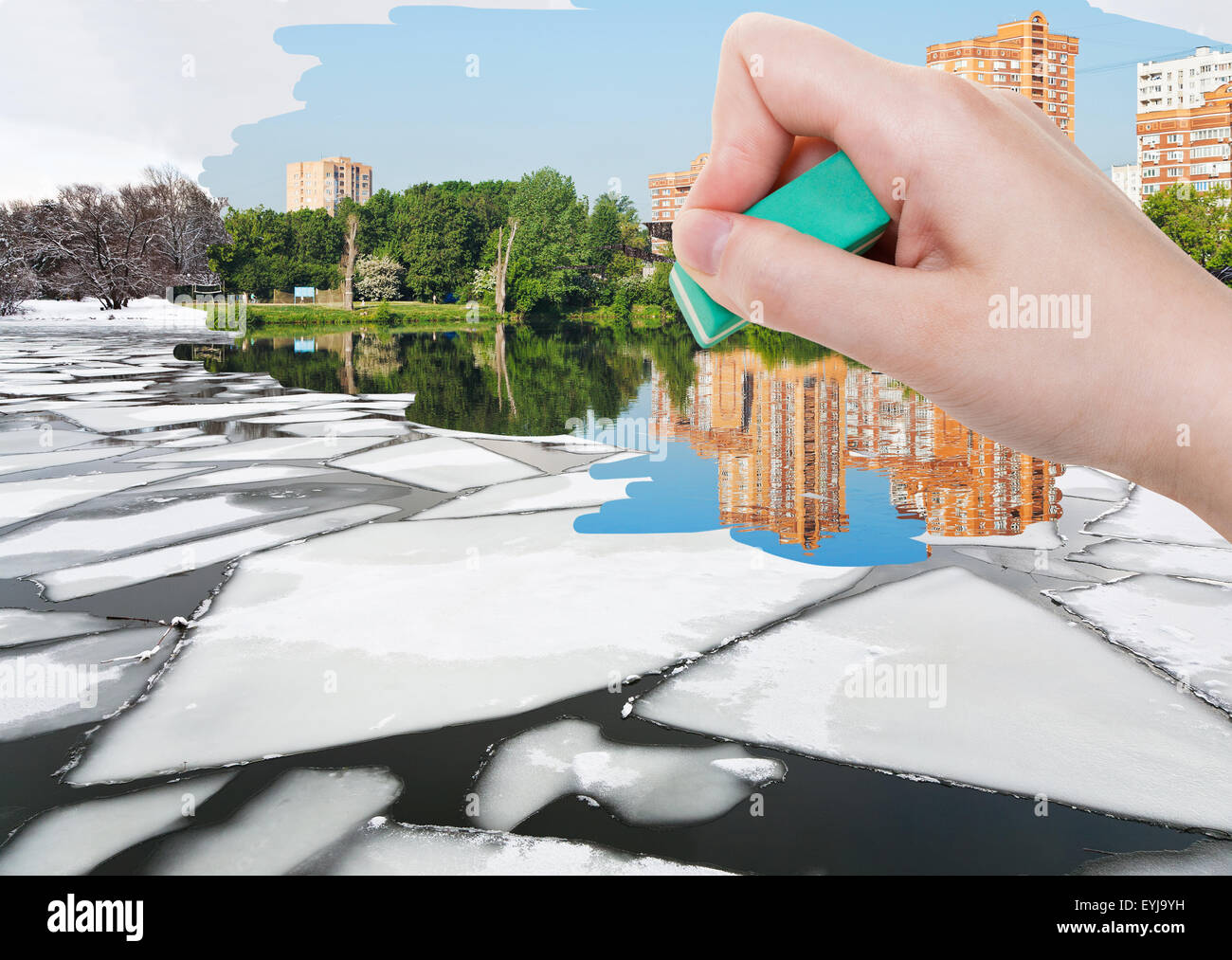 weather concept - hand deletes ice floe near river waterfront in winter ...