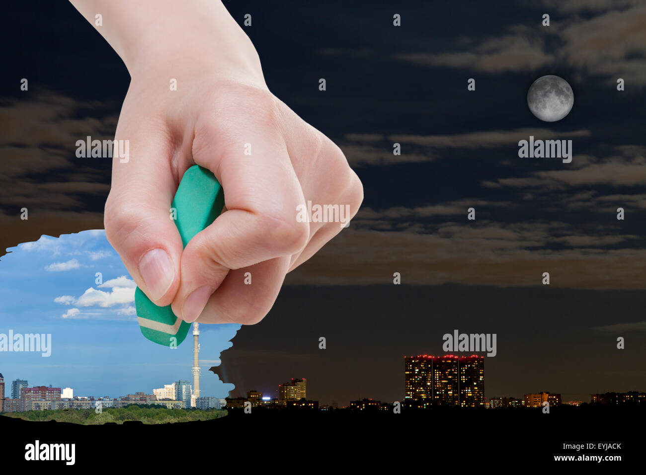 weather concept - hand deletes night cityscape by rubber eraser from ...