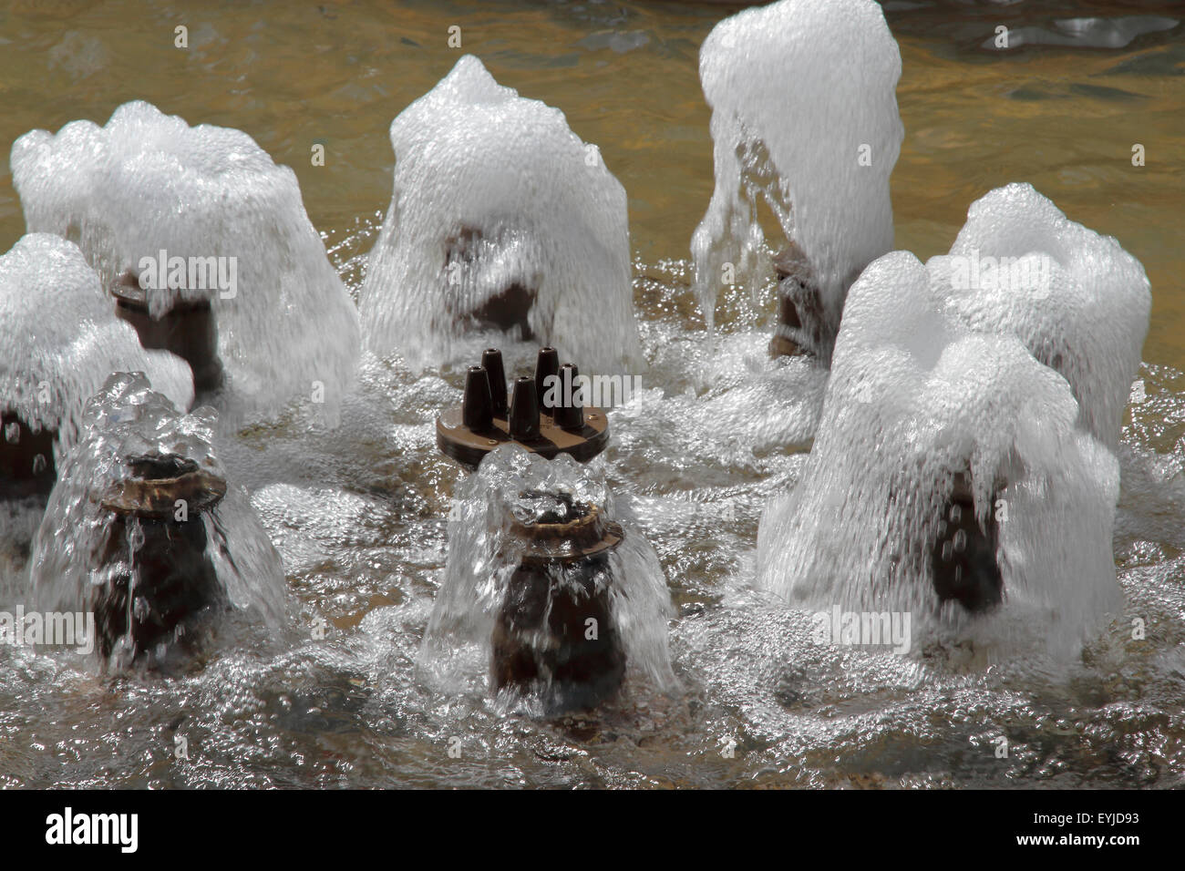 background of fountain spouts releasing water Stock Photo - Alamy