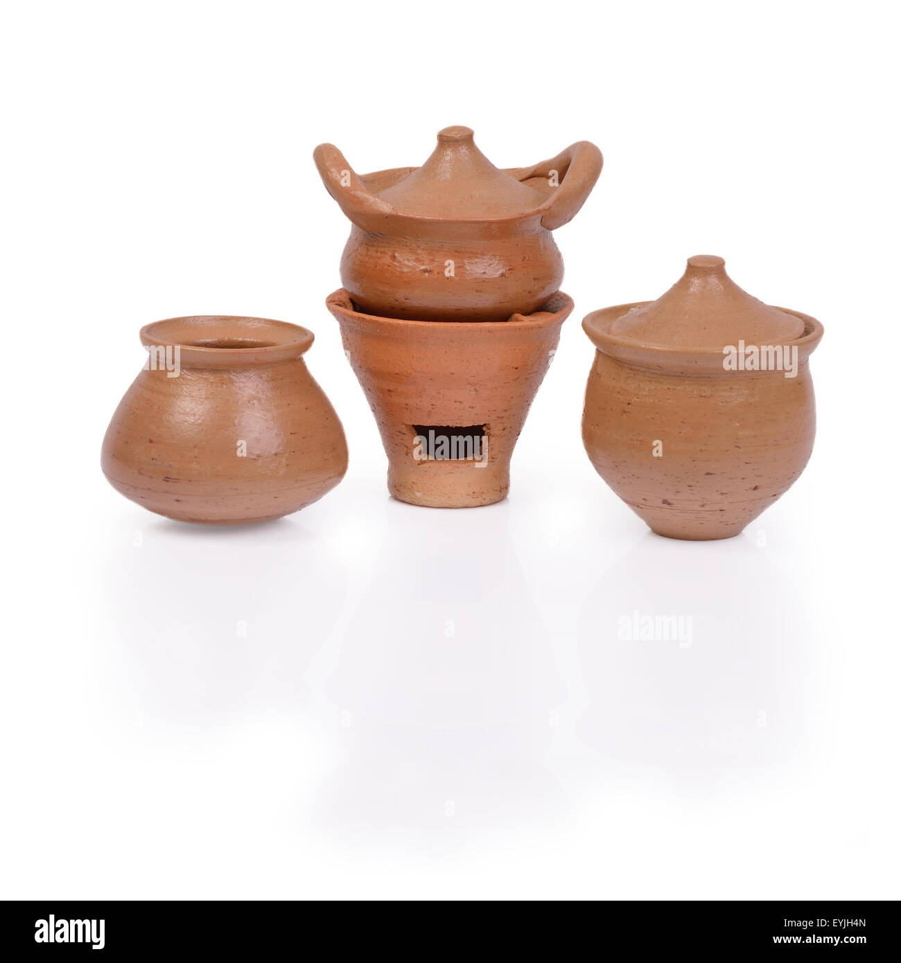 Thai handicraft souvenir, mini pot and oven made by clay on white ...