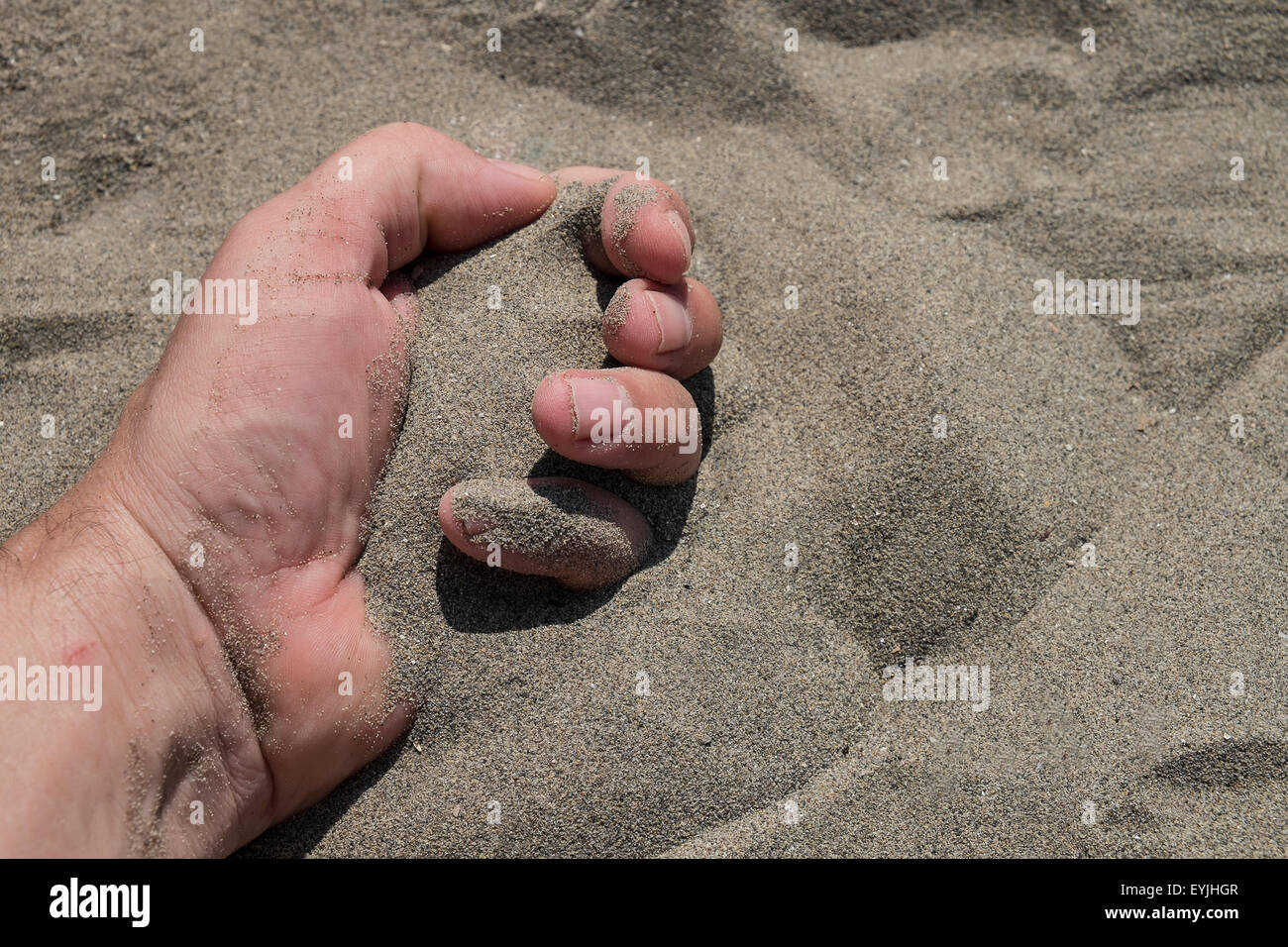the hand in the sand Stock Photo - Alamy