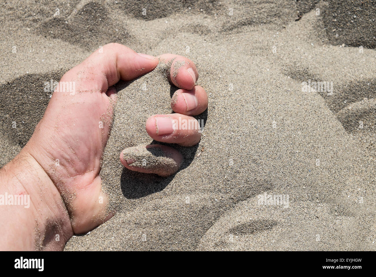 the hand in the sand Stock Photo - Alamy