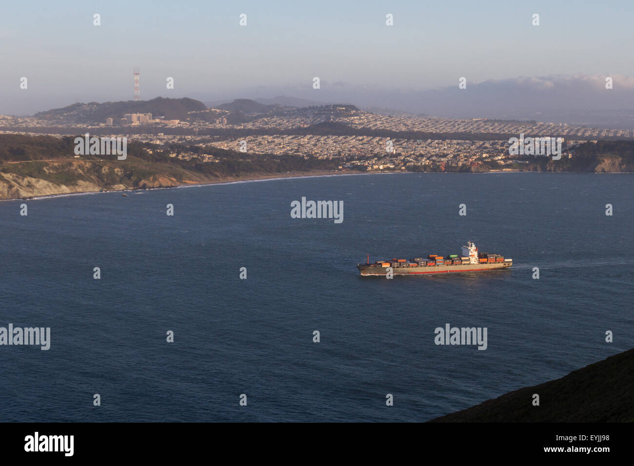 Large shipping container entering the Bay Area at sun set Stock Photo ...