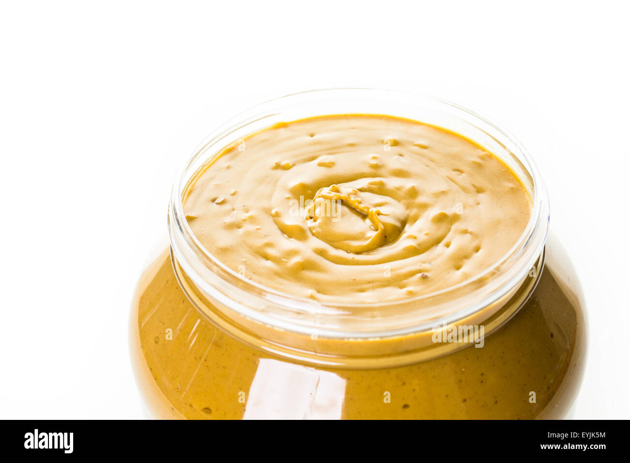 Extra chunky peanut butter on a white background Stock Photo - Alamy