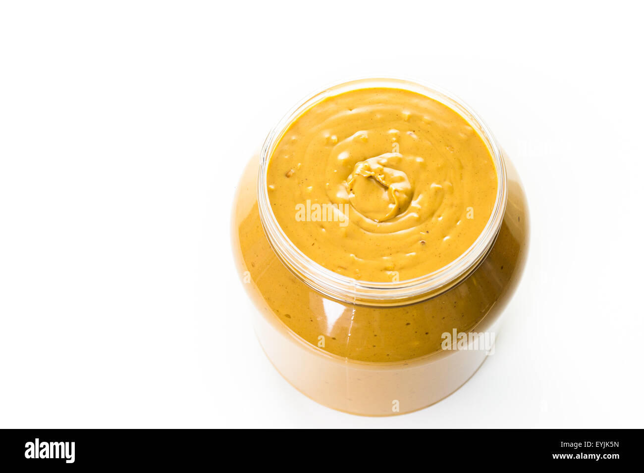 Extra chunky peanut butter on a white background Stock Photo - Alamy