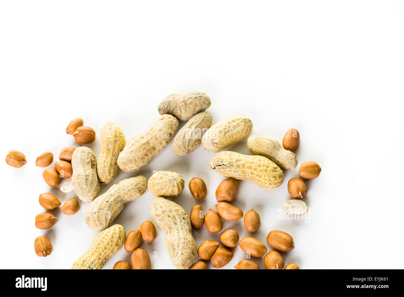 Peanuts peeled and in shells on a white background Stock Photo - Alamy