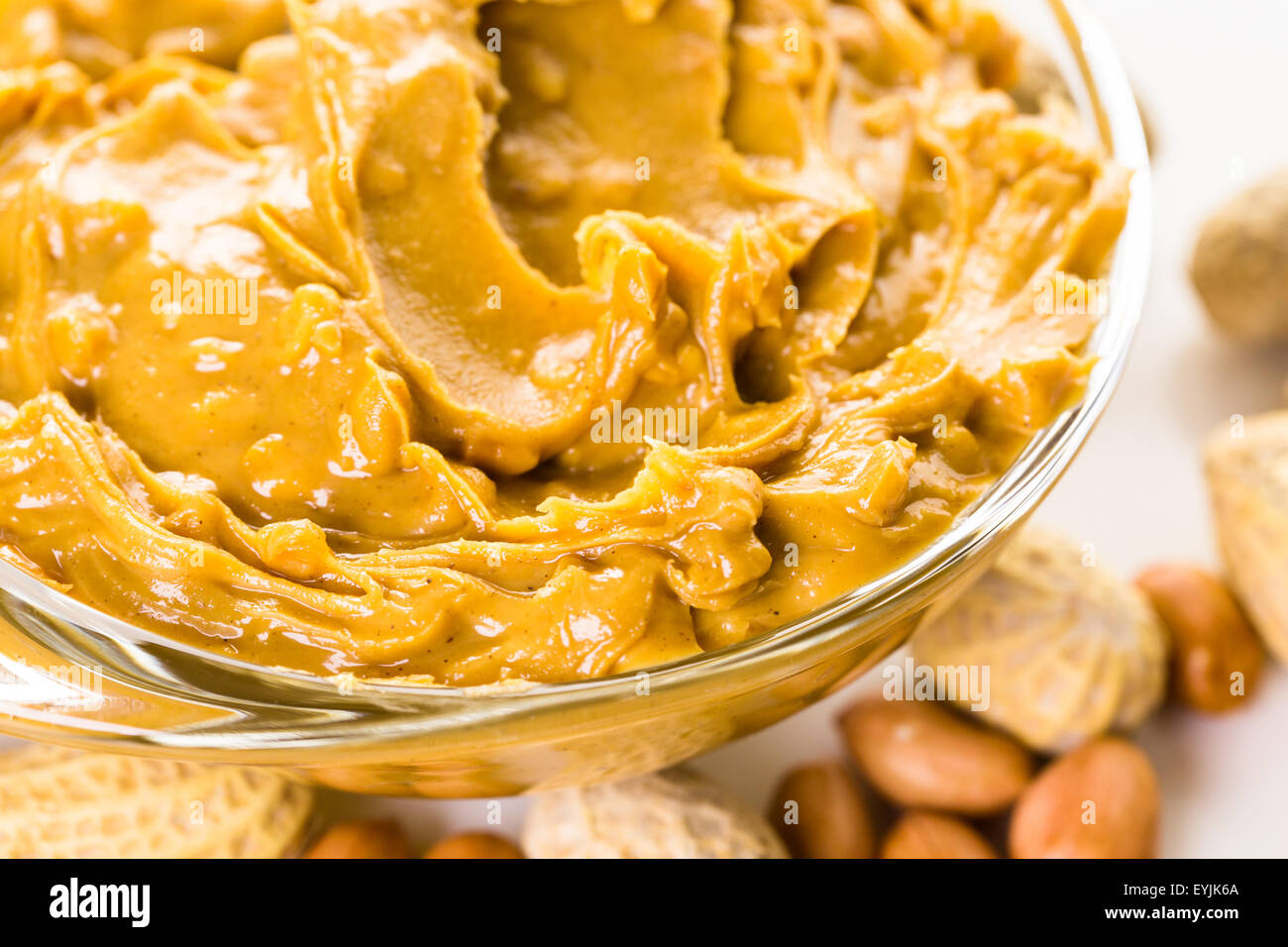 Extra chunky peanut butter on a white background Stock Photo - Alamy