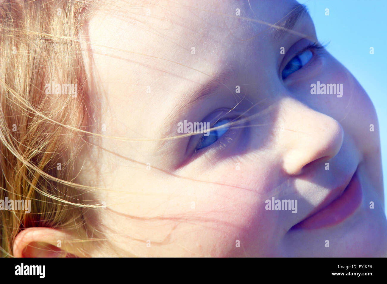 portrait of little squinting girl with nice face and blue eyes Stock ...