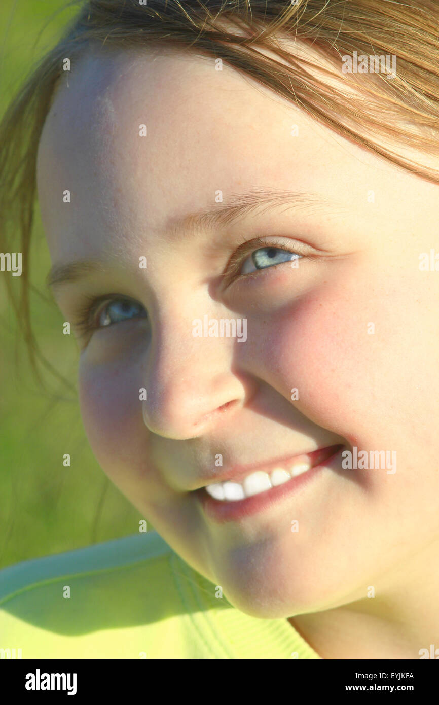 little squinting girl with nice face and blue eyes Stock Photo - Alamy